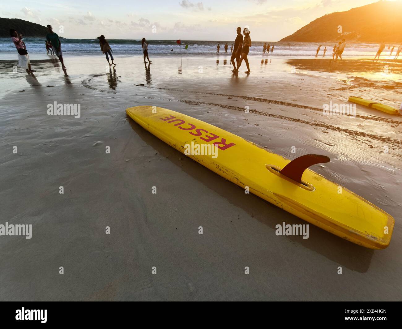 Bright yellow rescue surfboard at the ocean beach Stock Photo - Alamy
