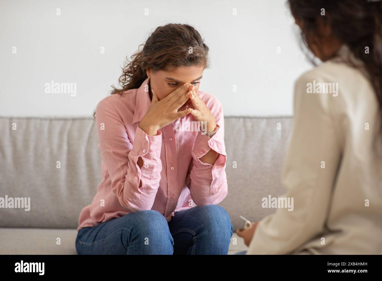 Woman Sitting On Couch During Therapy Session, Crying Stock Photo - Alamy