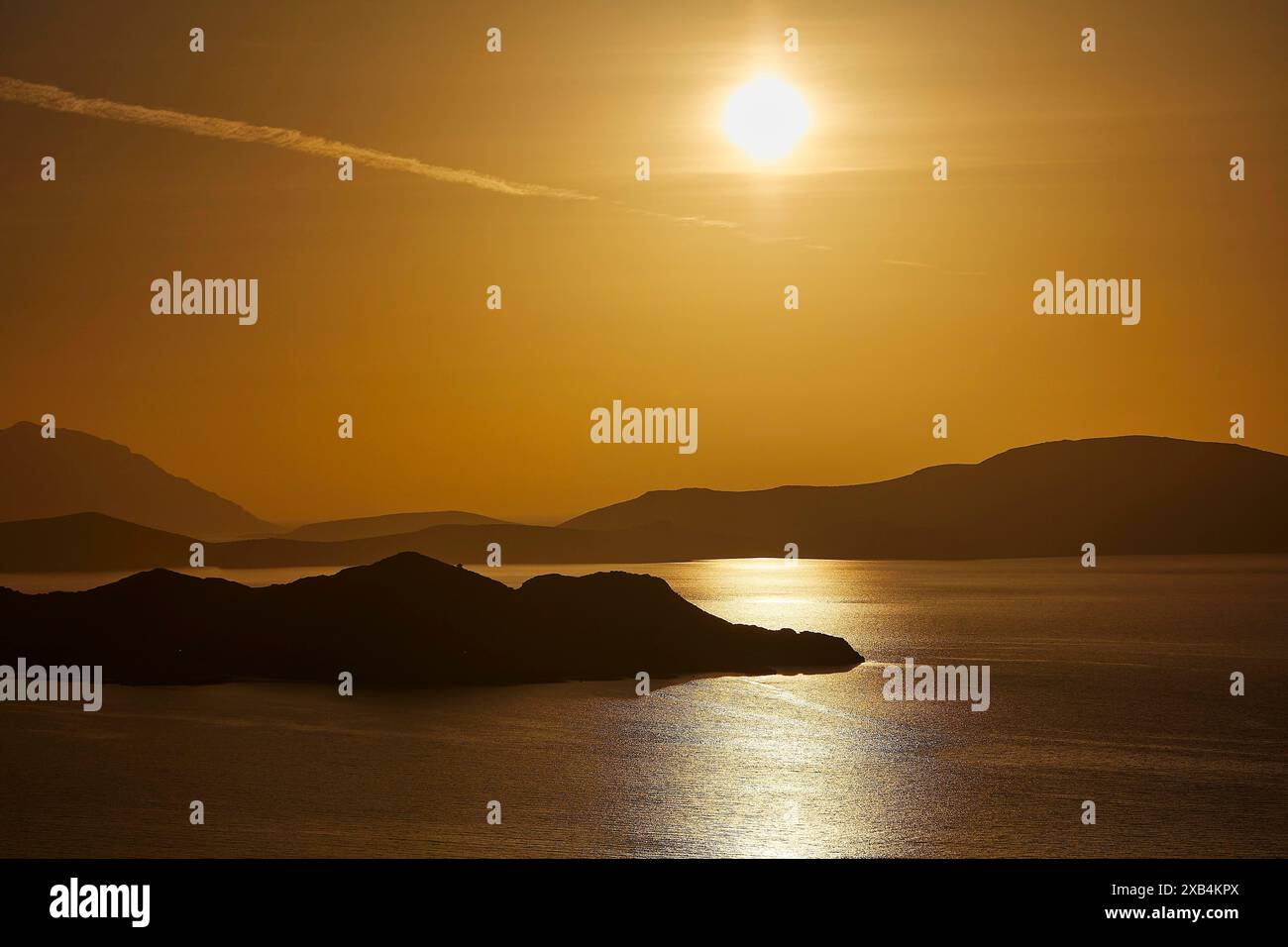 Golden sunset over calm sea with silhouetted archipelago, Makri Island ...