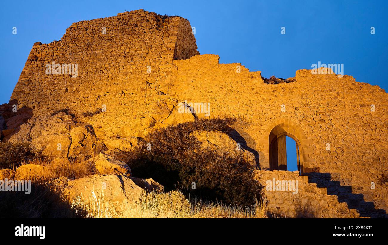 Night shot, close-up of an illuminated old castle ruin with stone steps ...