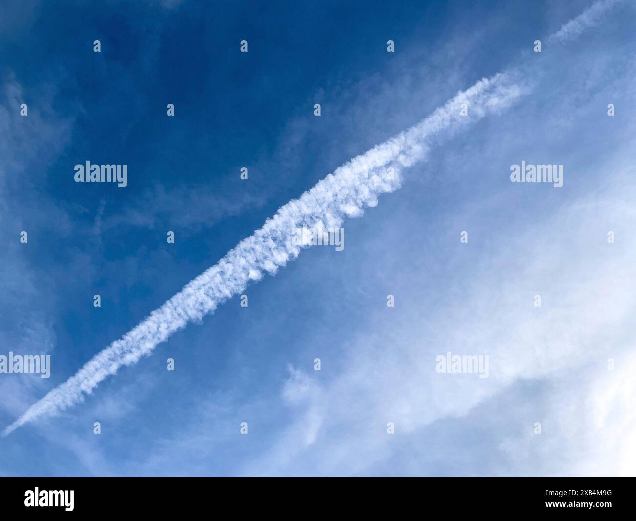 Dissipating contrail high thin cloud artificially created by aircraft ...