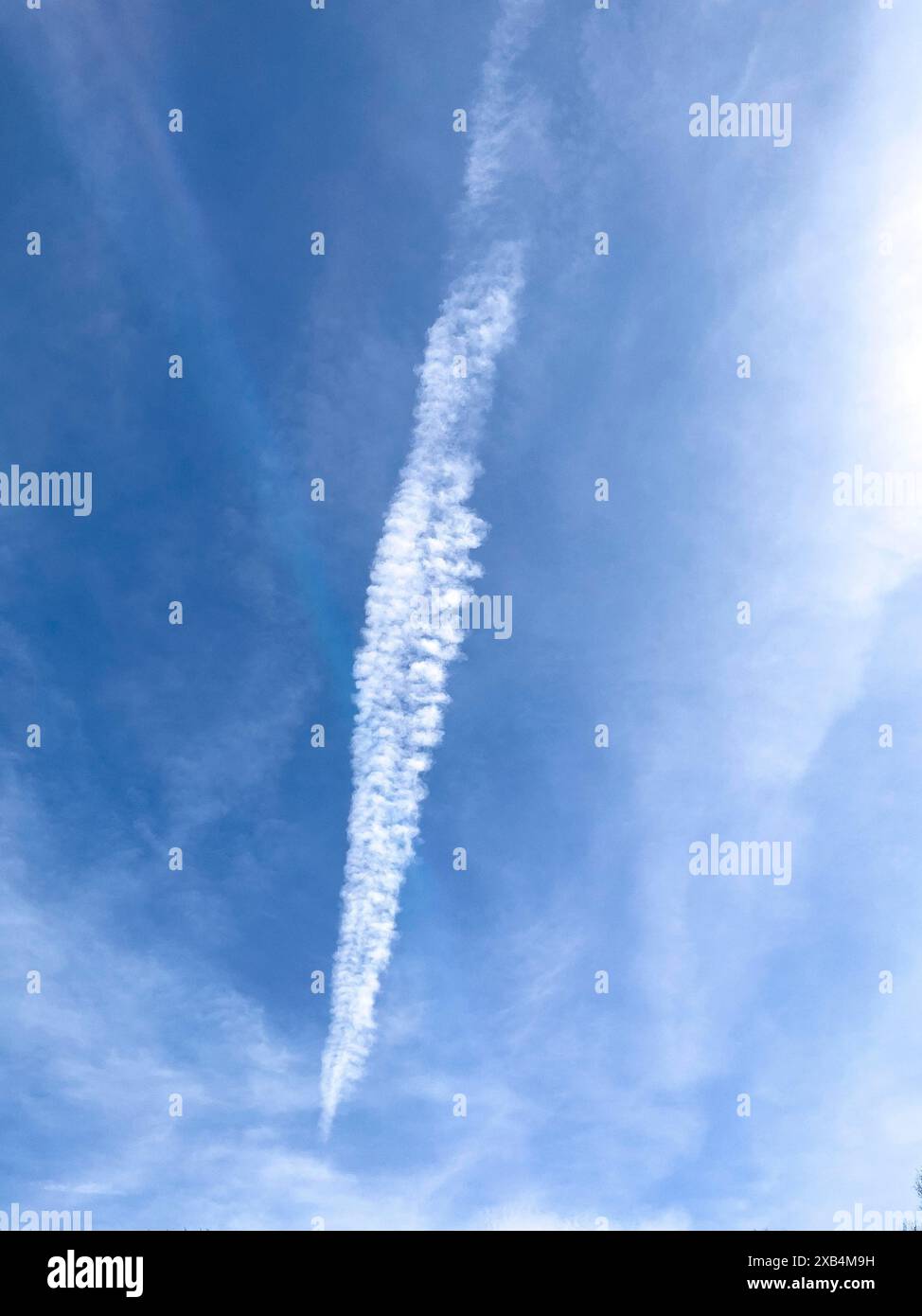 Dissipating contrail high thin cloud artificially created by aircraft ...