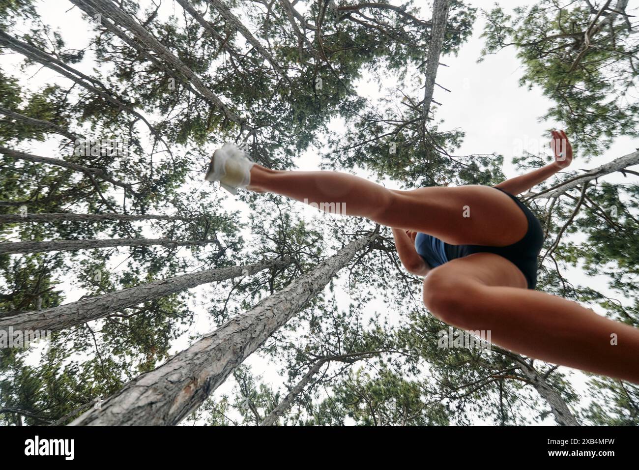 Adventurous Woman Overcoming Forest Obstacles with Determination and ...