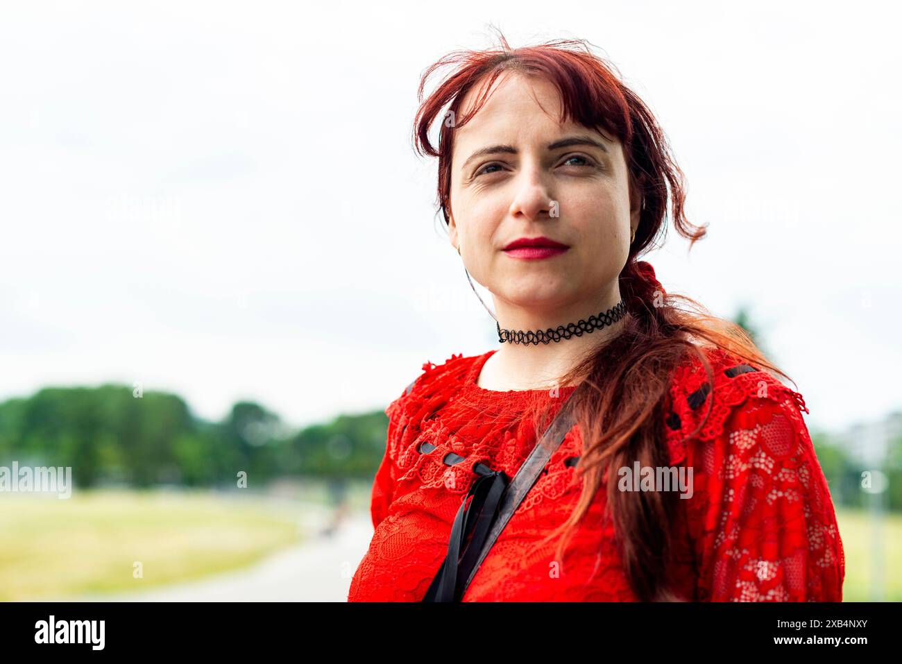 Portrait Redhaired Woman Portrait redhaired woman in a city park ...