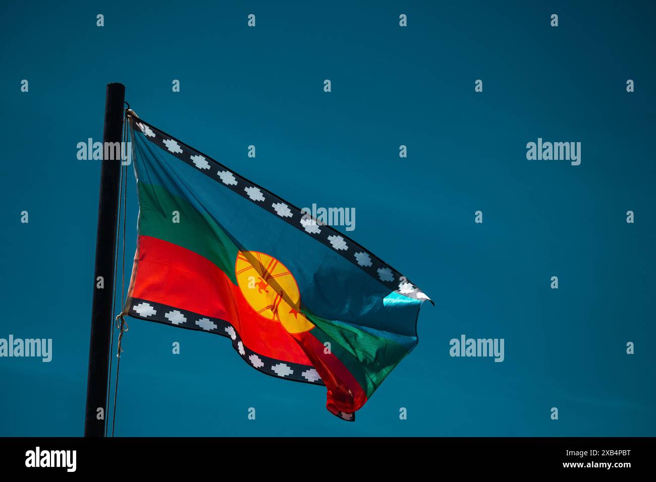 Flag of the original Mapuche people in blue sky Stock Photo - Alamy