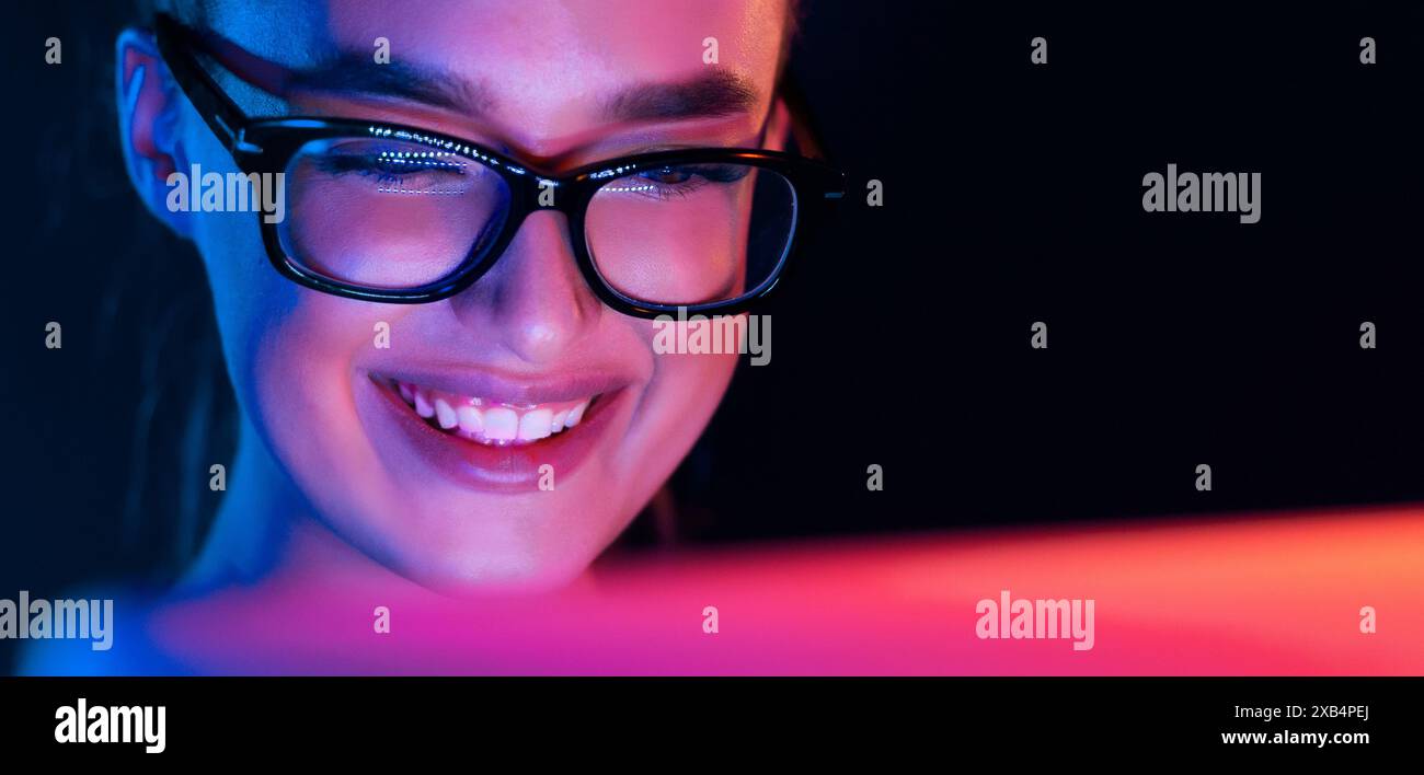 Woman Wearing Glasses Smiling at Computer Screen, Working at Night ...