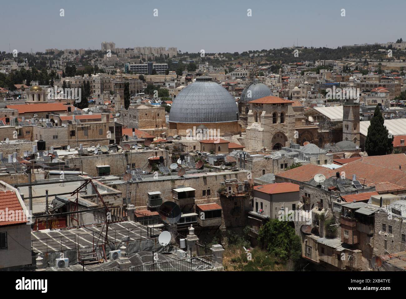 Rooftops in the Old City of Jerusalem and the grey domes of the Church ...