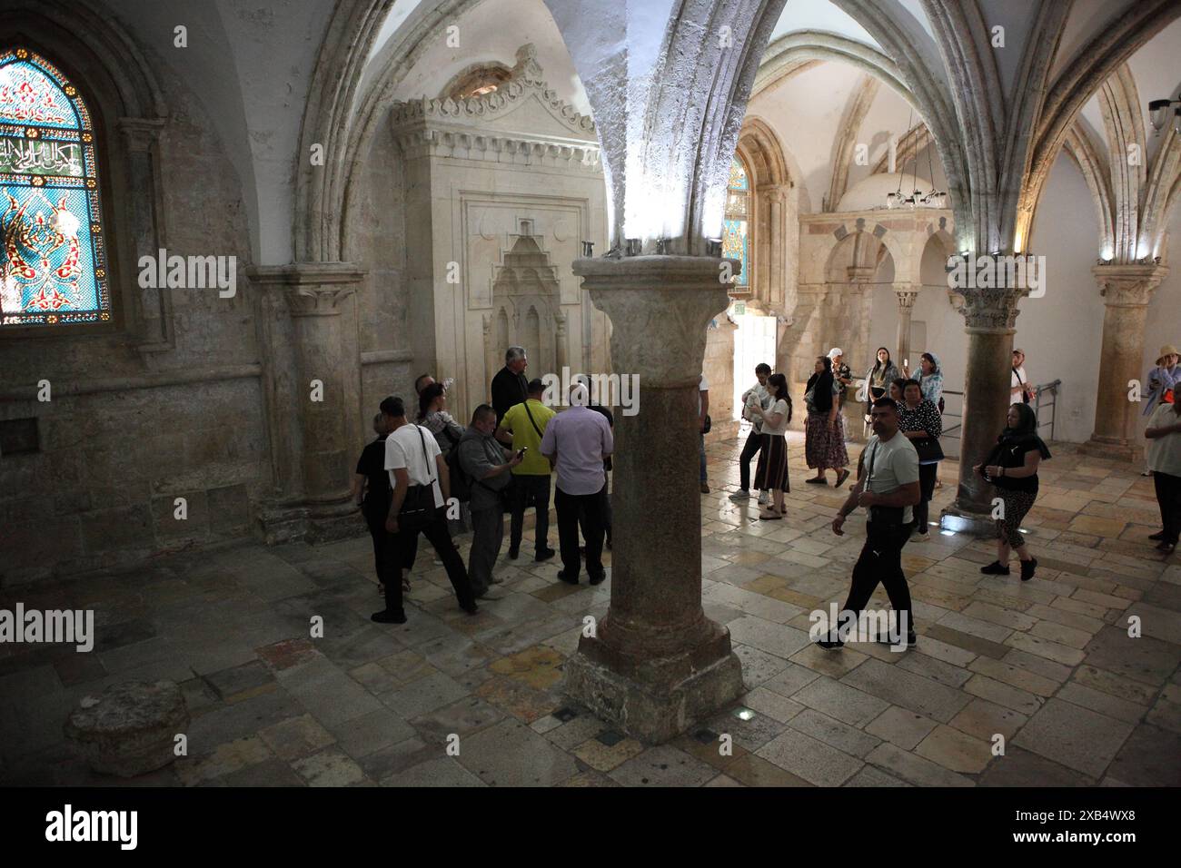 Pilgrims visit the 12th century Last Supper Room on Mt. Zion where ...