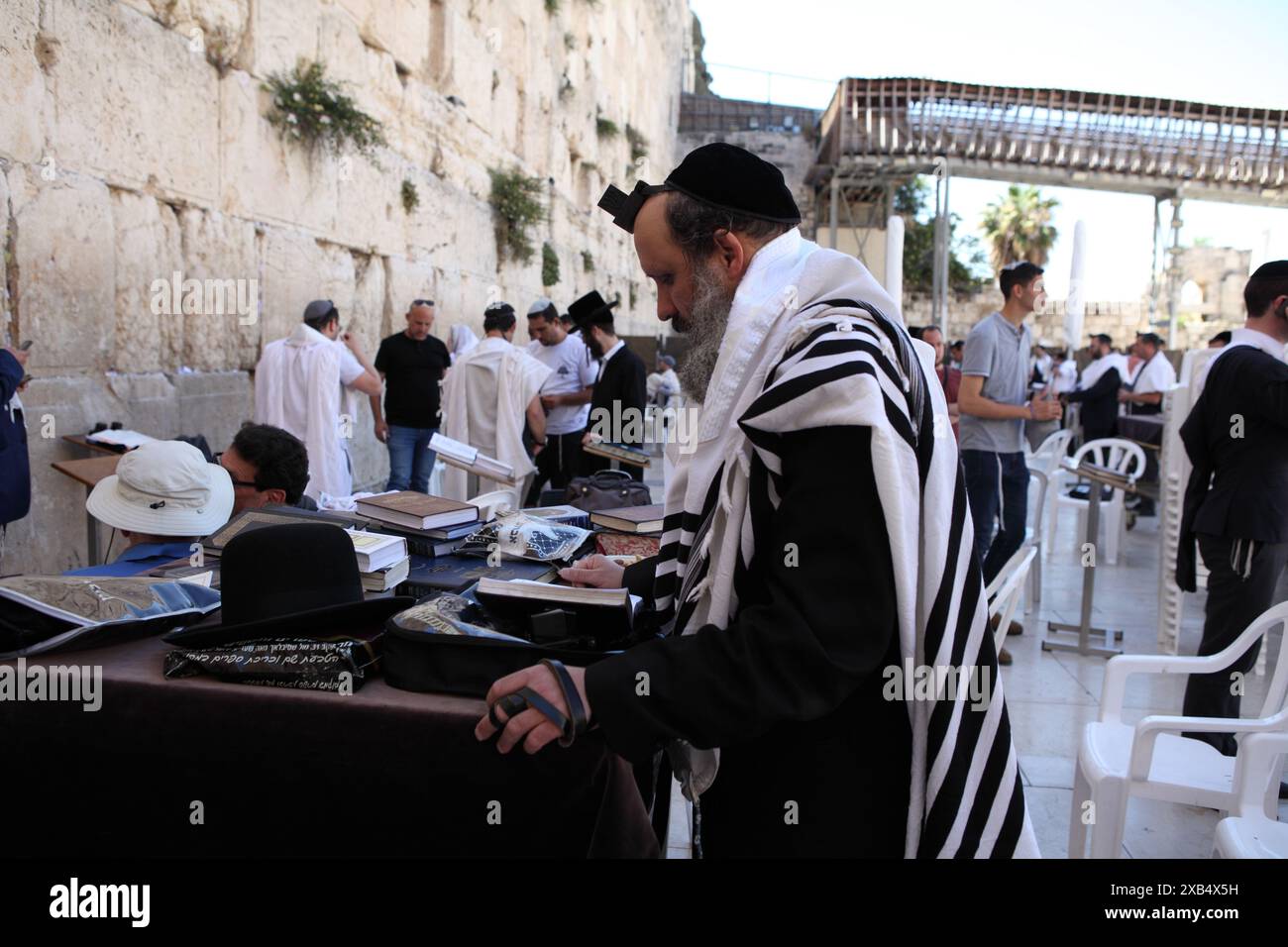 Ultra Orthodox Jew wearing a Talith and Tefillin prays and meditates ...