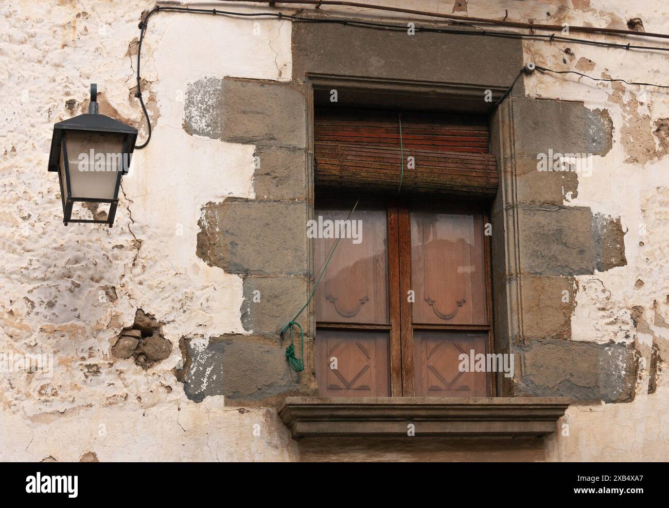 We can see a typical window of the old town houses in Spain, in the ...