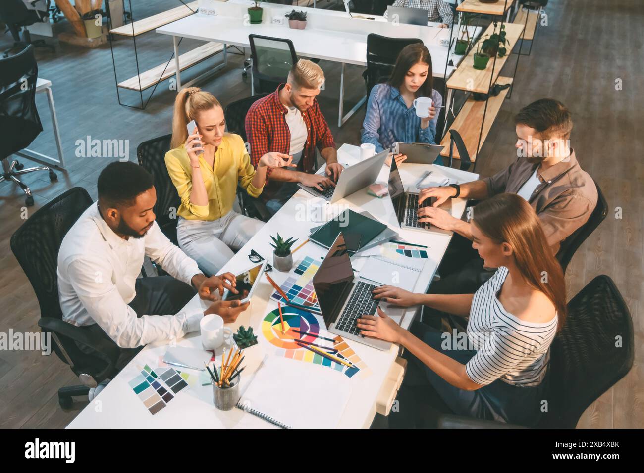 Group of People Working on Laptops at Table Stock Photo - Alamy