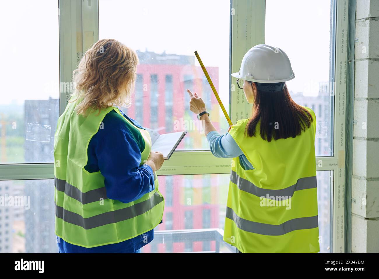Two workers taking measurements hi-res stock photography and images - Alamy