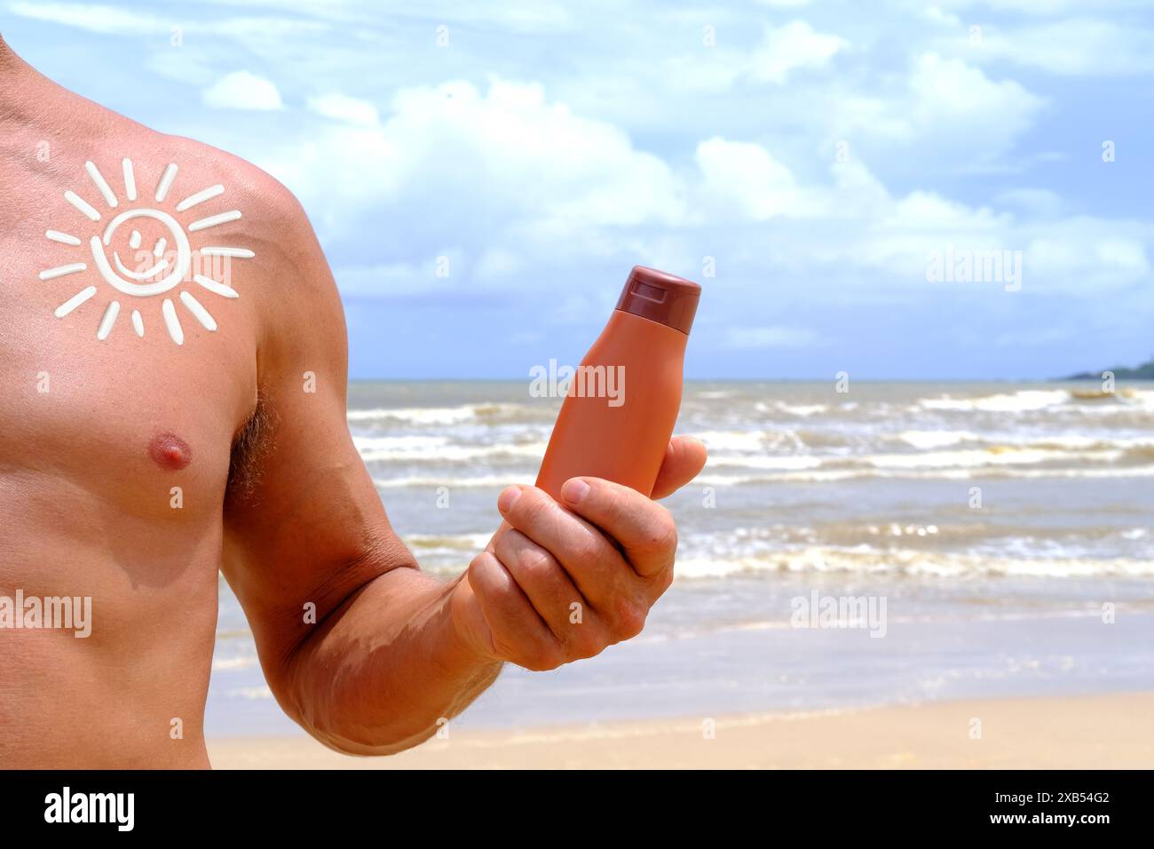 brown mockup sunscreen cream, lotion bottle in tanned male hand, sea ...