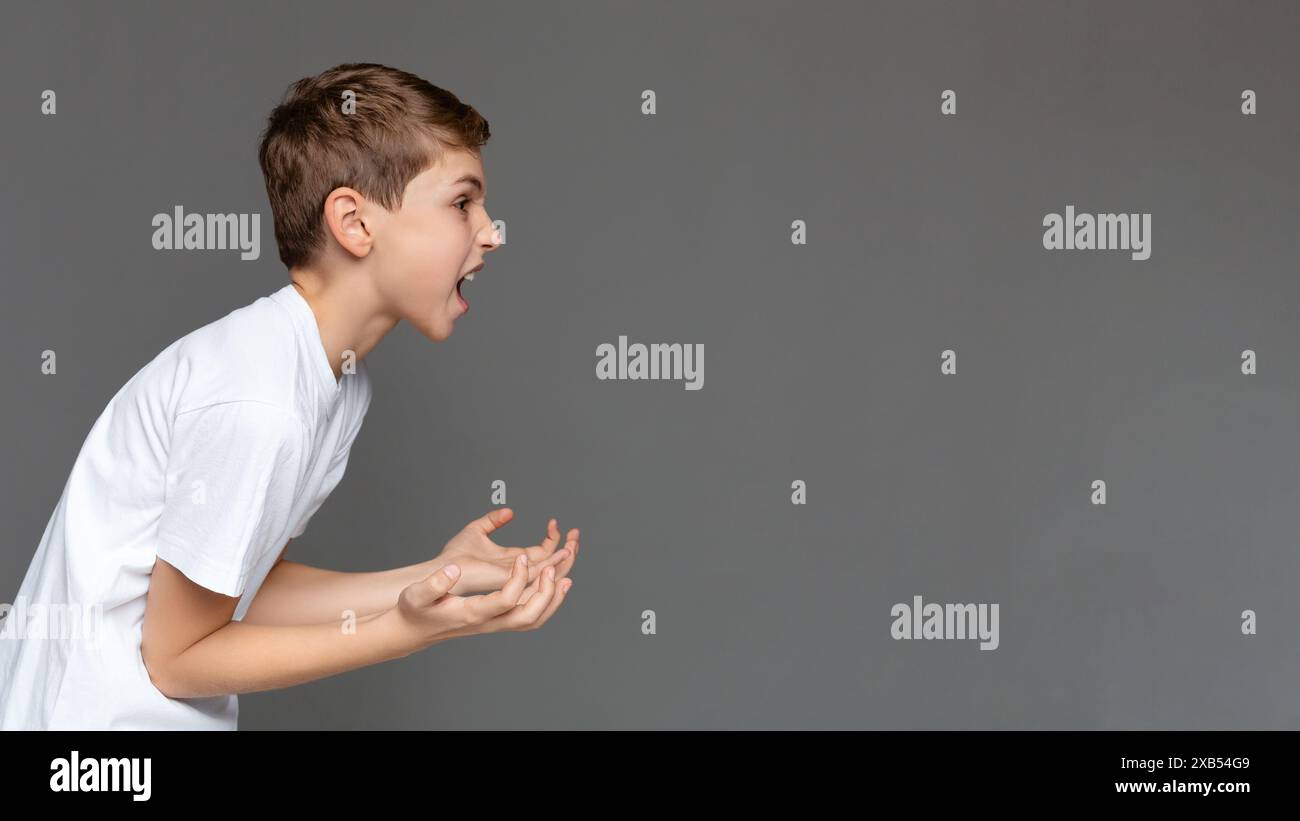 Angry boy screaming and gesturing with hands in air Stock Photo - Alamy