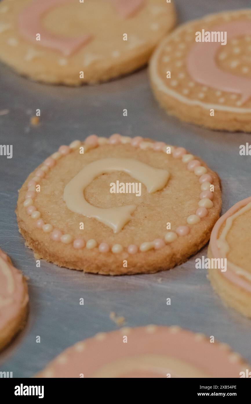 pink party cookies decorated with letter Stock Photo - Alamy