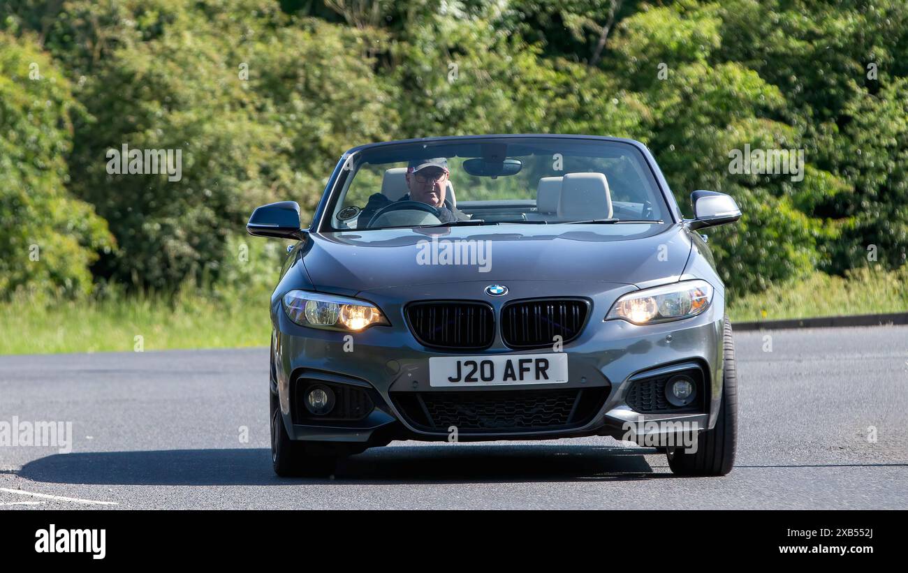 Stony Stratford,UK - June 2nd 2024: 2015 grey BMW 220 car driving on a ...