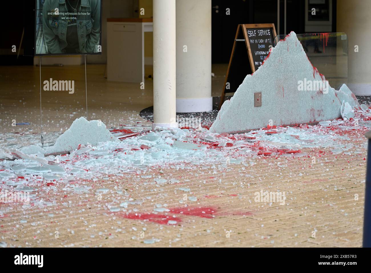 Barclays Bank all windows smashed and red paint splashed on building ...