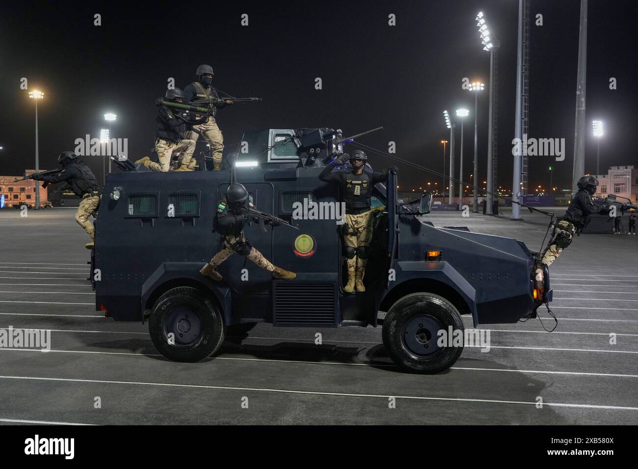 Members of the Saudi forces for Hajj and Umrah perform a military ...