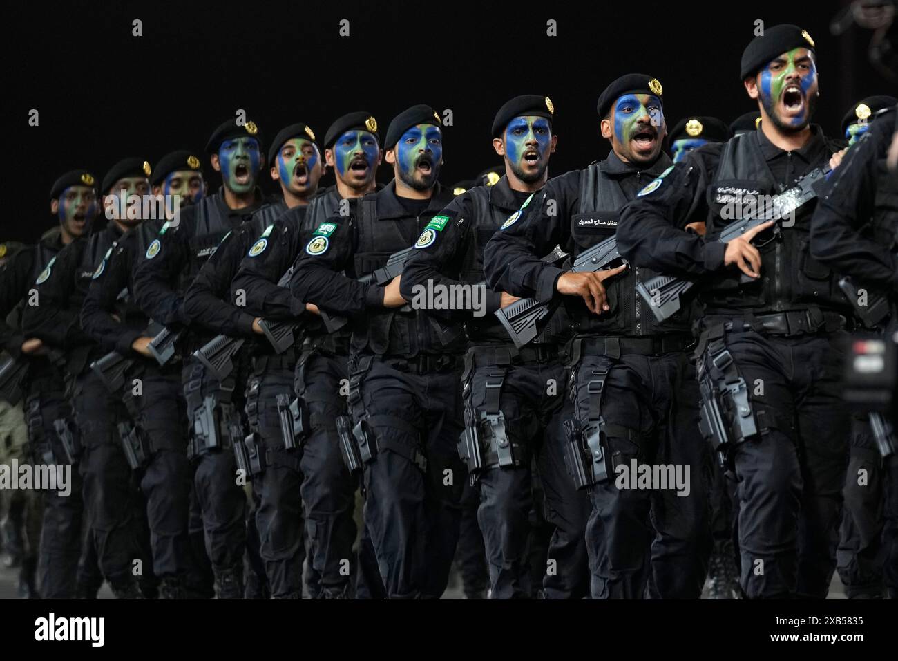 Members of the Saudi forces for Hajj and Umrah perform a military ...