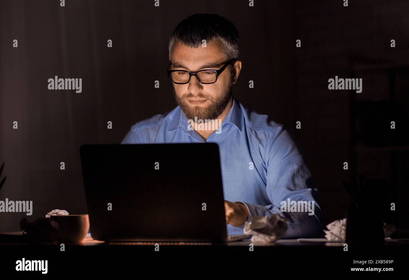 Man Working Late at Night in Home Office With Laptop Stock Photo - Alamy