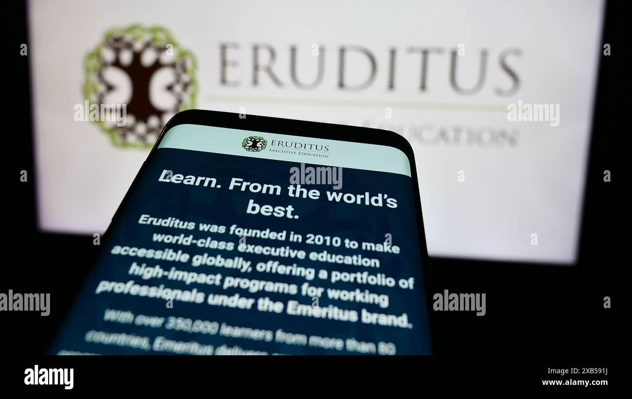 Smartphone with website of Singaporean company Eruditus Executive ...