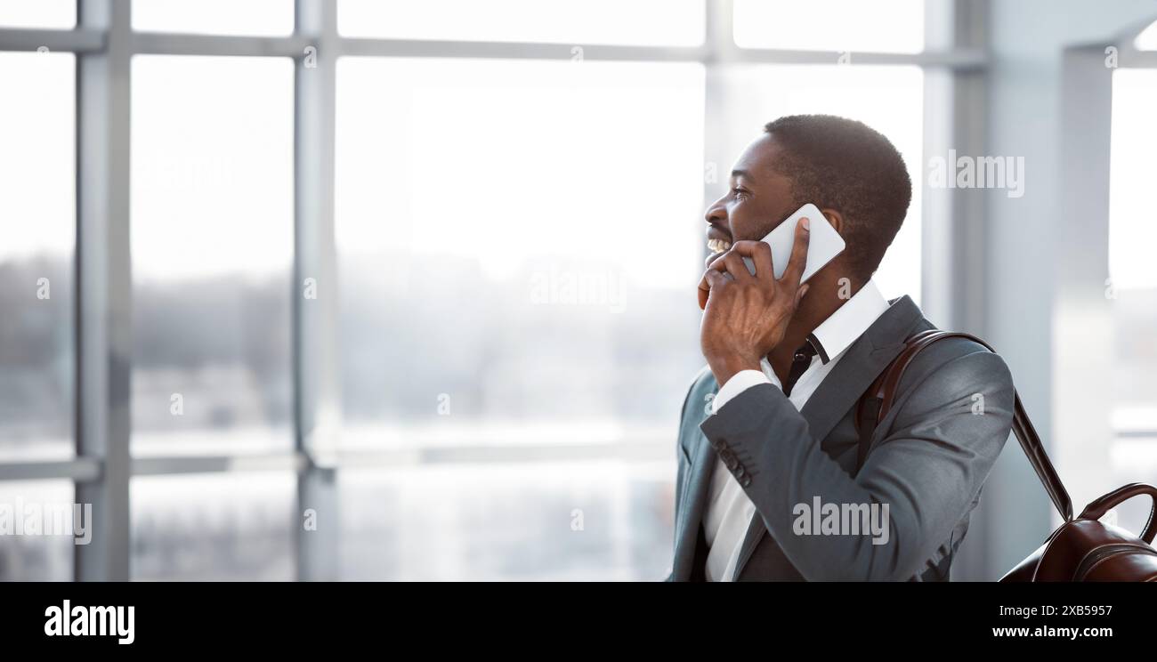 Travelling Businessman Making Phone Call, Arriving at Airport Stock ...