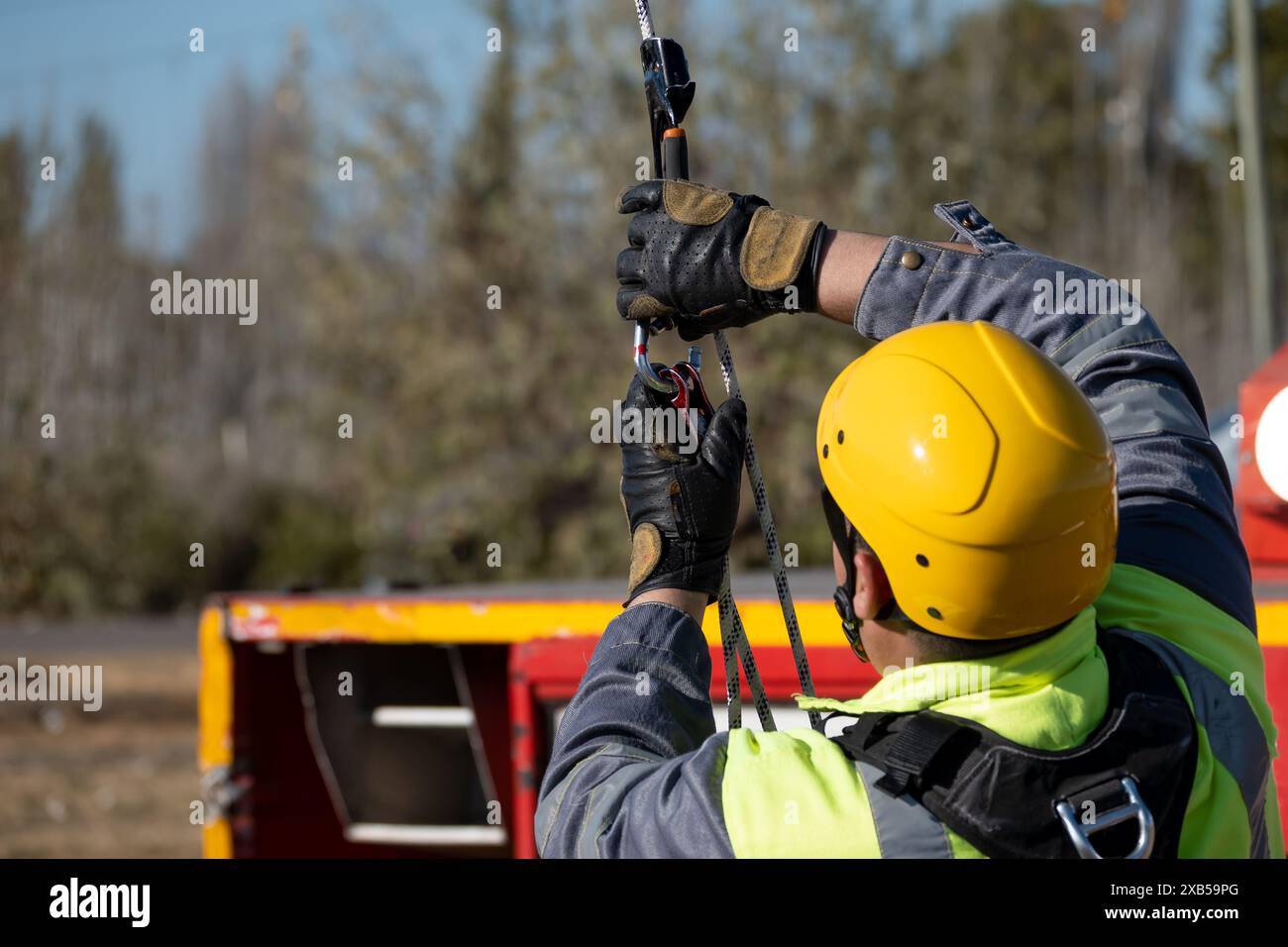 Firefighter, secure rope to lift stretcher Stock Photo - Alamy