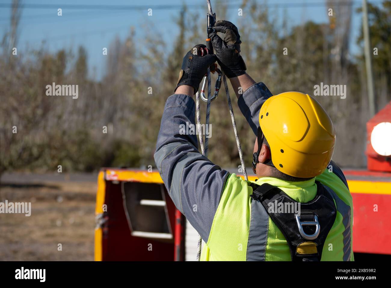 Firefighter, secure rope to lift stretcher Stock Photo - Alamy