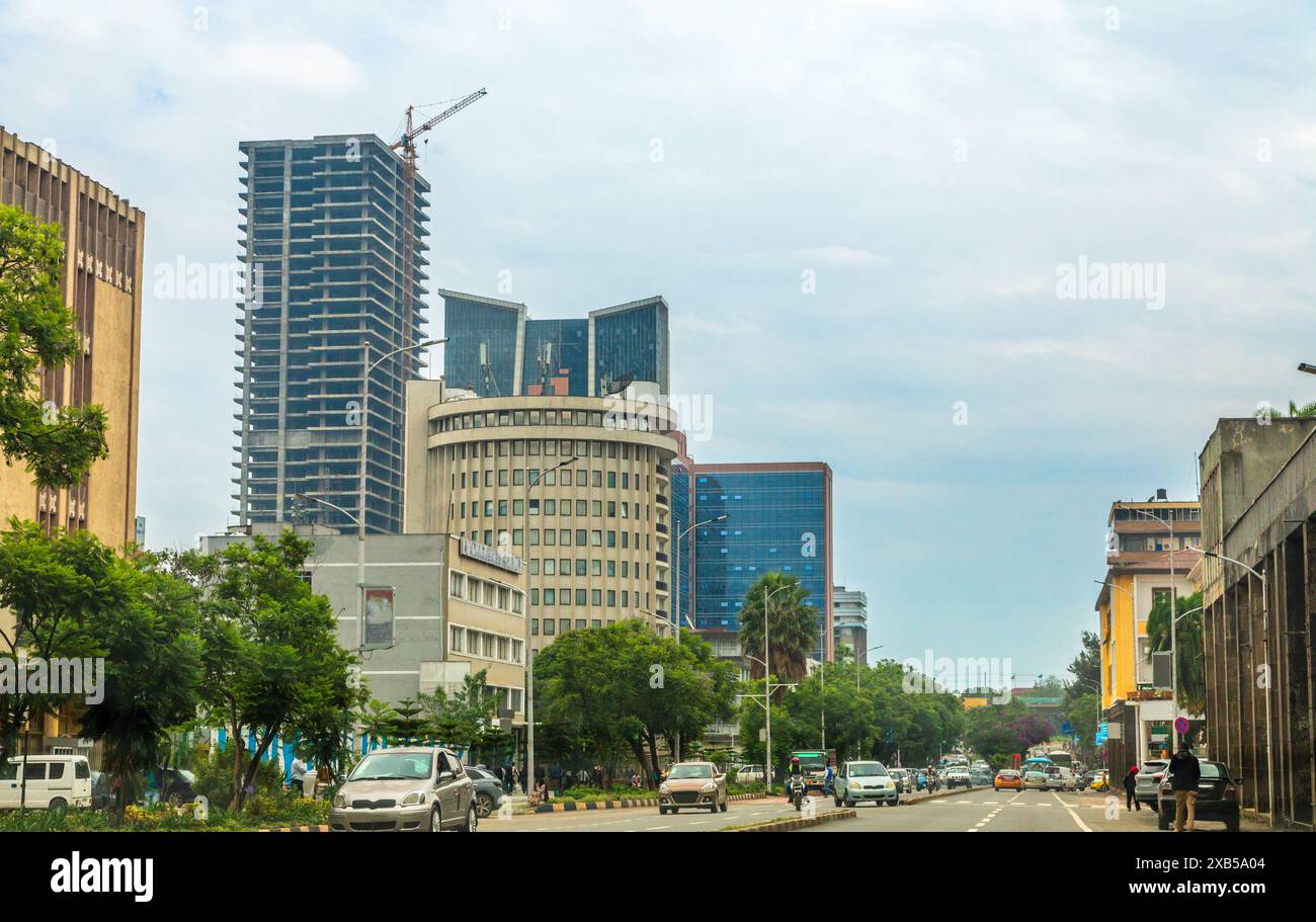 Road full of cars and rapidly developing downtown of central business ...