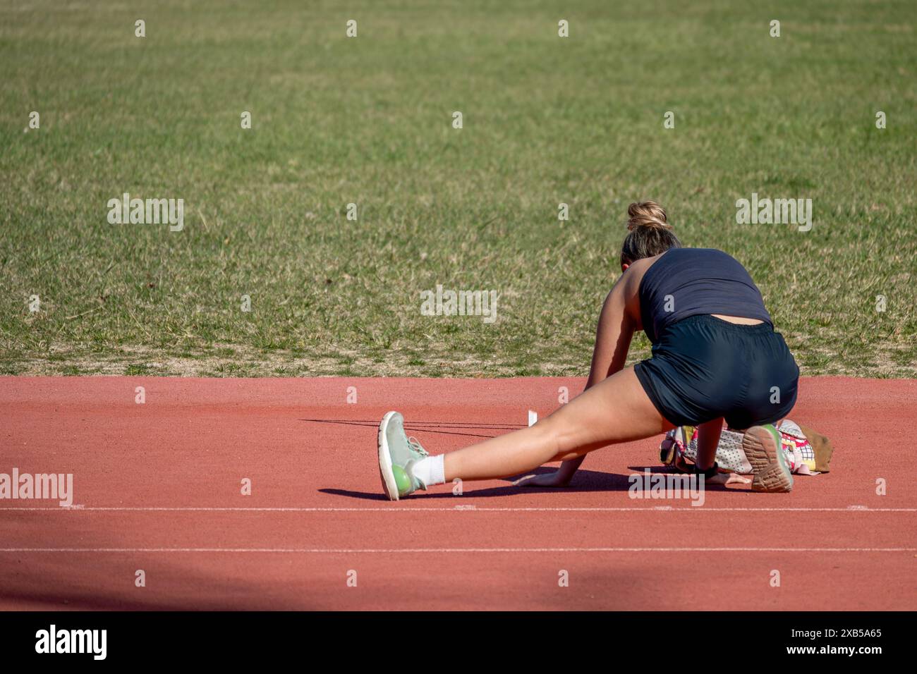 Caucasian sportswoman stretch after exercise hi-res stock photography ...