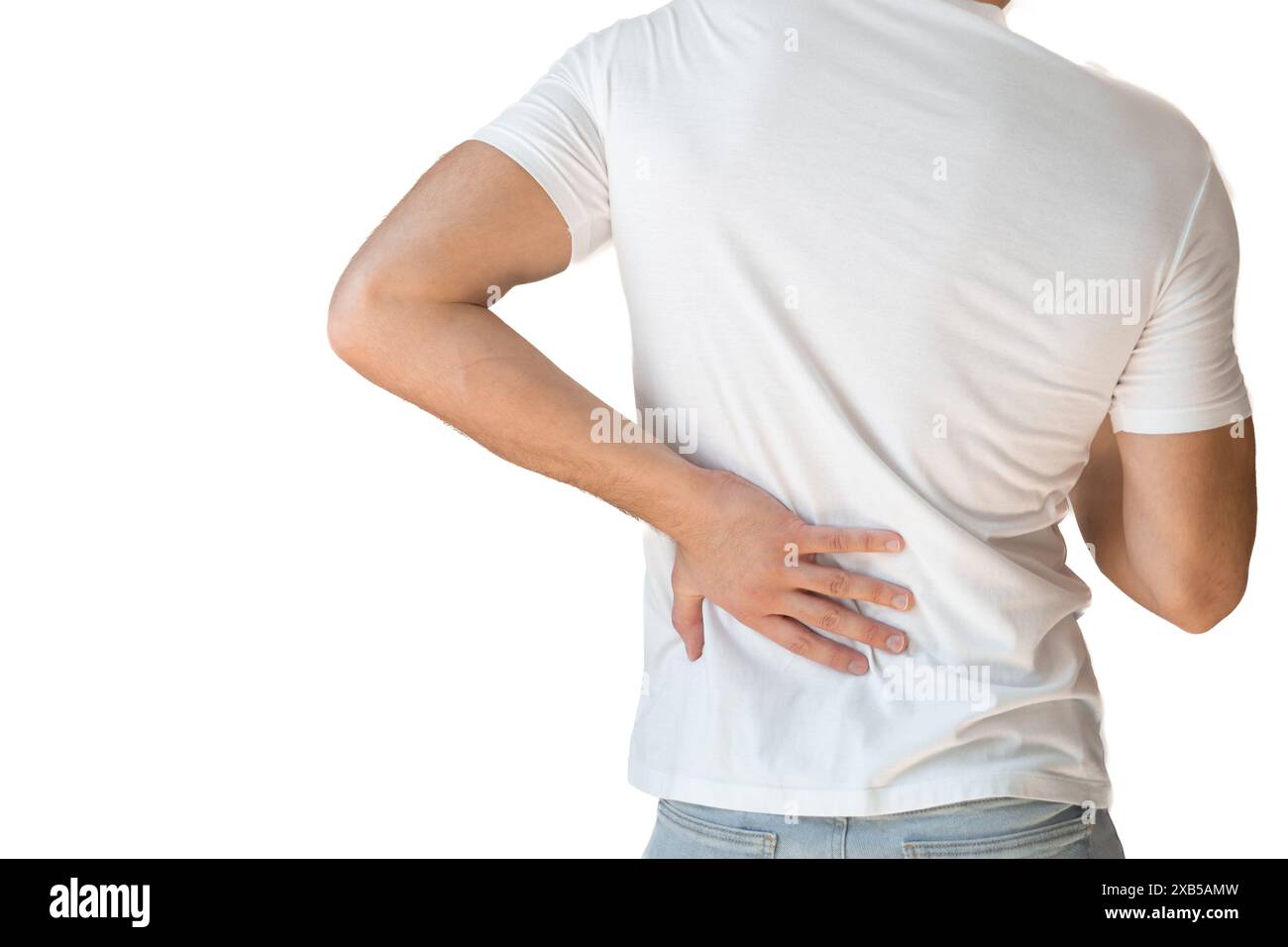 Rear view of a handsome attractive young man holding his back in pain ...