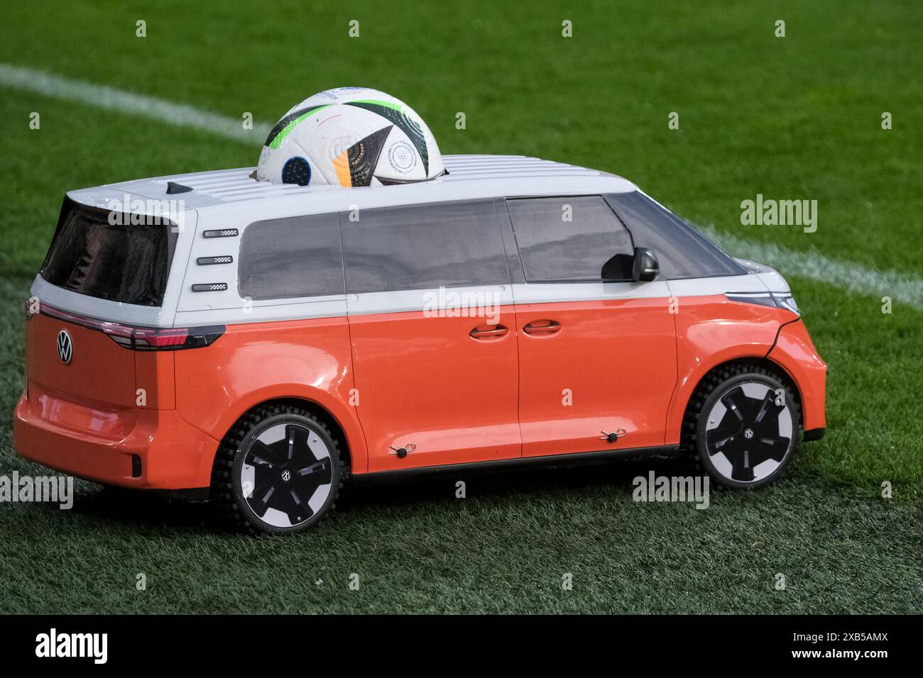 A remote control car brings the match ball to the center of the pitch ...