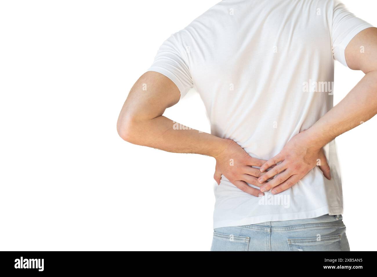 Rear view of a handsome attractive young man holding his back in pain ...