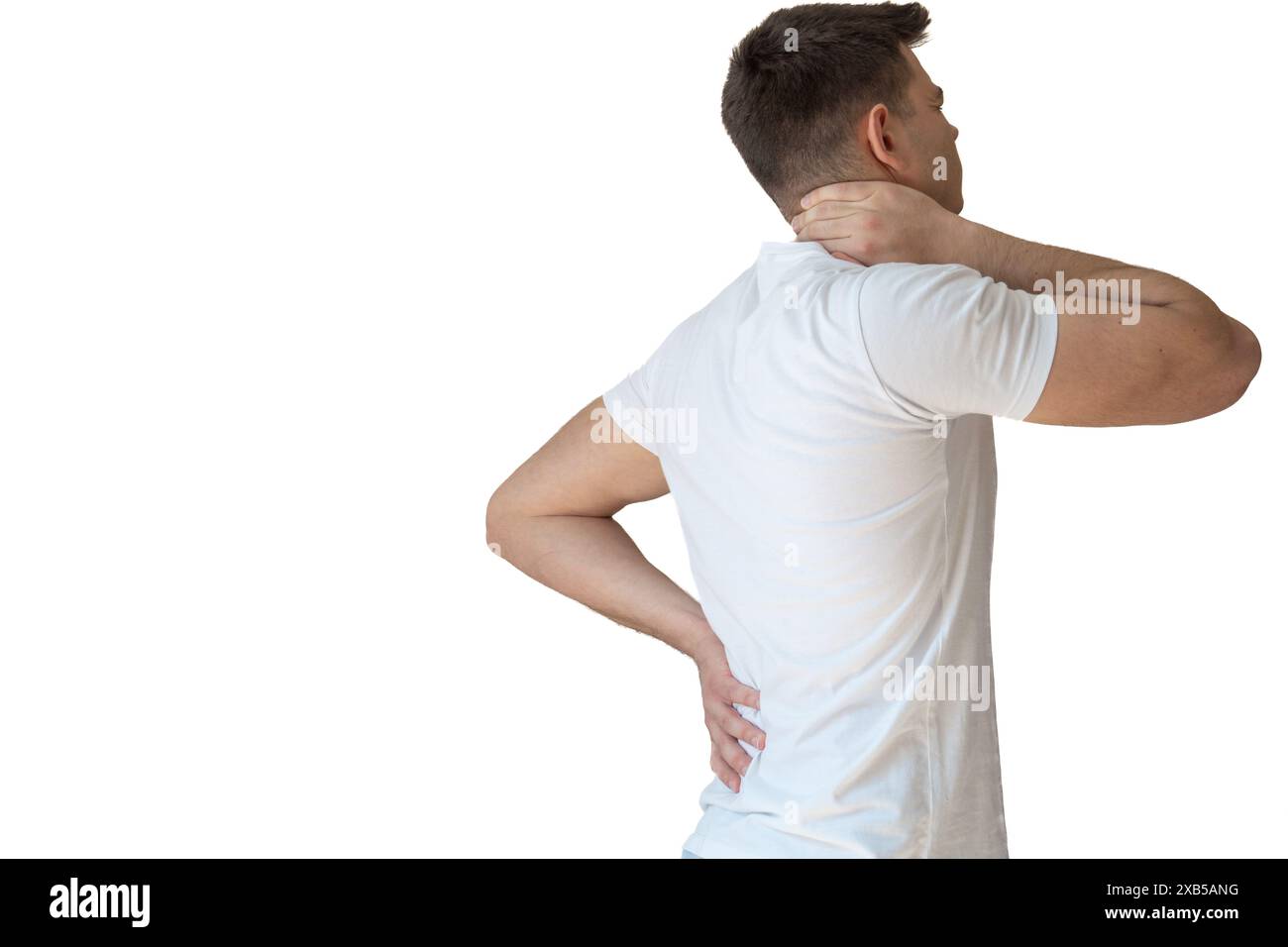 Rear view of a handsome young man in white shirt holding his neck in ...