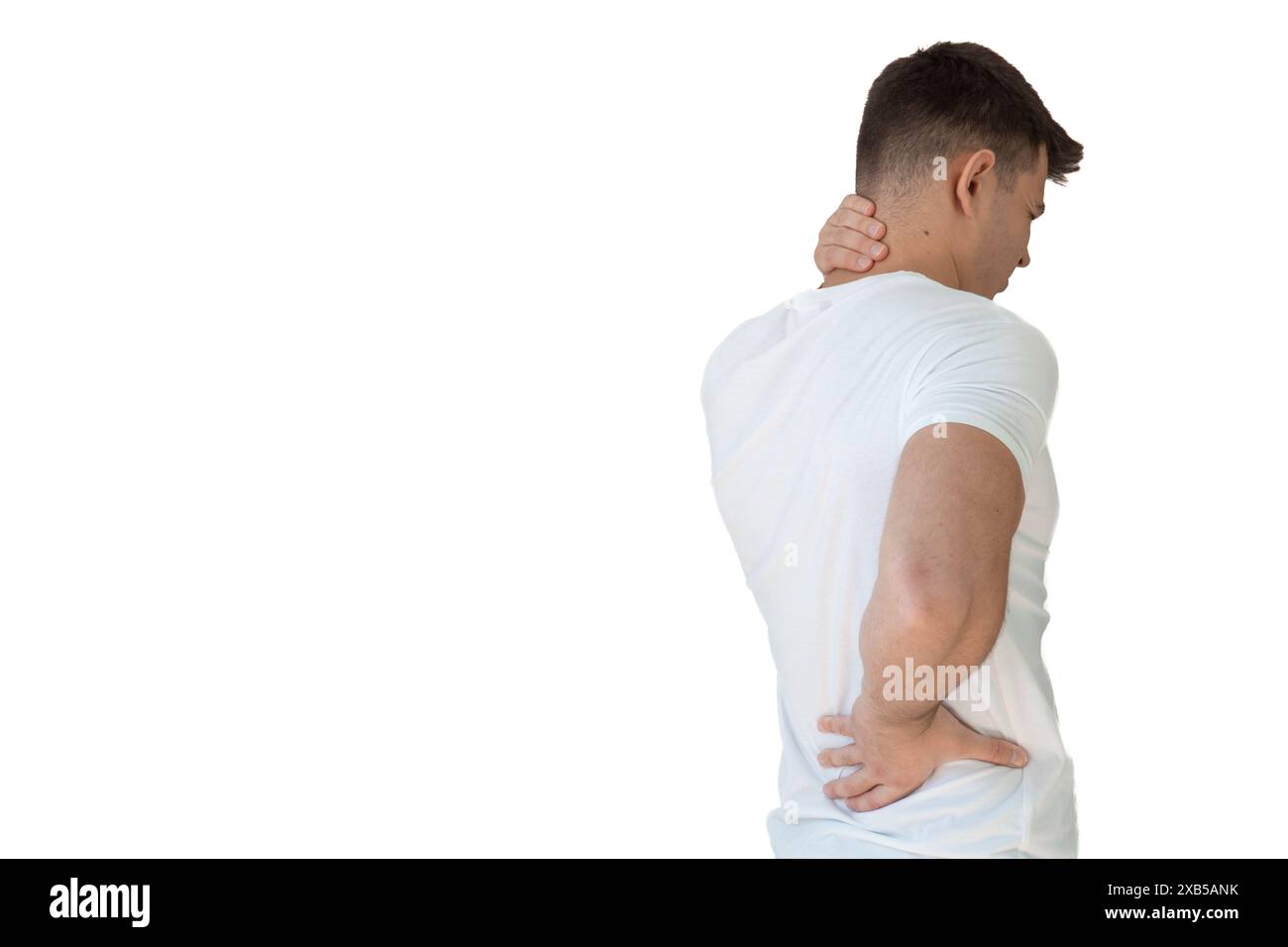 Rear view of a handsome young man in white shirt holding his neck in ...
