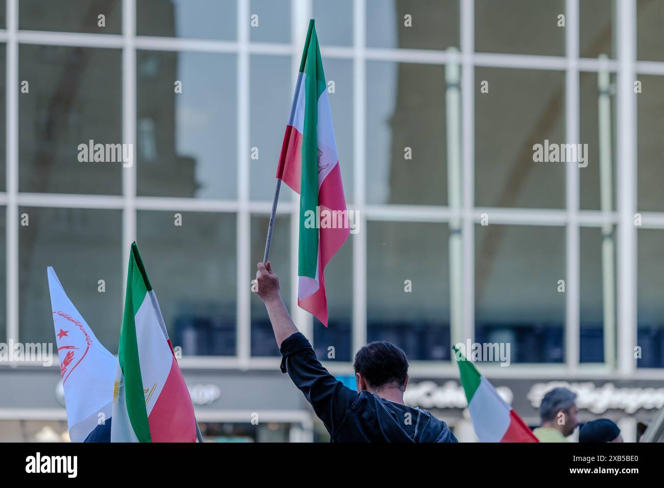Cologne, Germany - May 22, 2024 : View of people holding flags of Iran ...