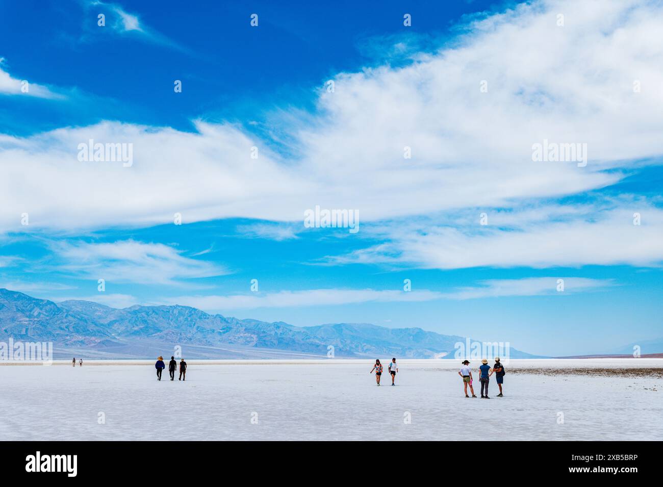 Visitors explore the salt flats at Badwater Basin; minus 282' below sea ...