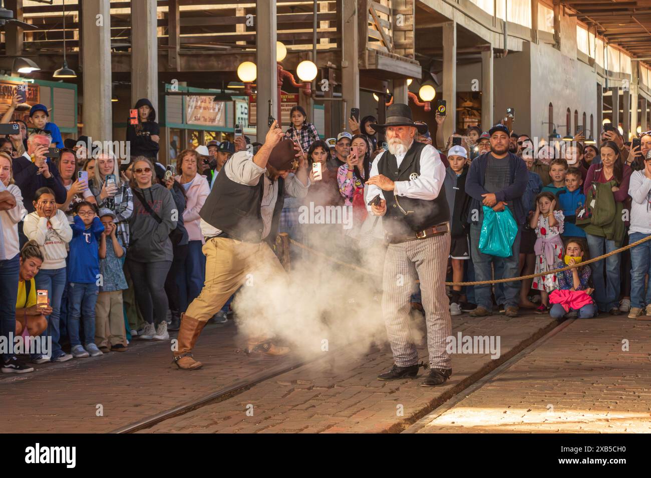 Entertainers putting on a show reliving a gunfight in the old west ...