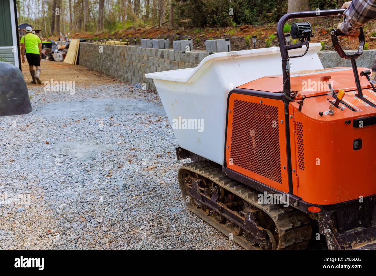 Construction workers use dumper tracked wheelbarrow when pouring ...