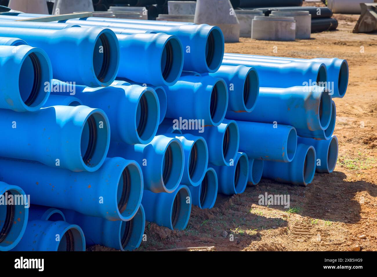 On construction site, there are blue PVC pipes for laying pipe water ...