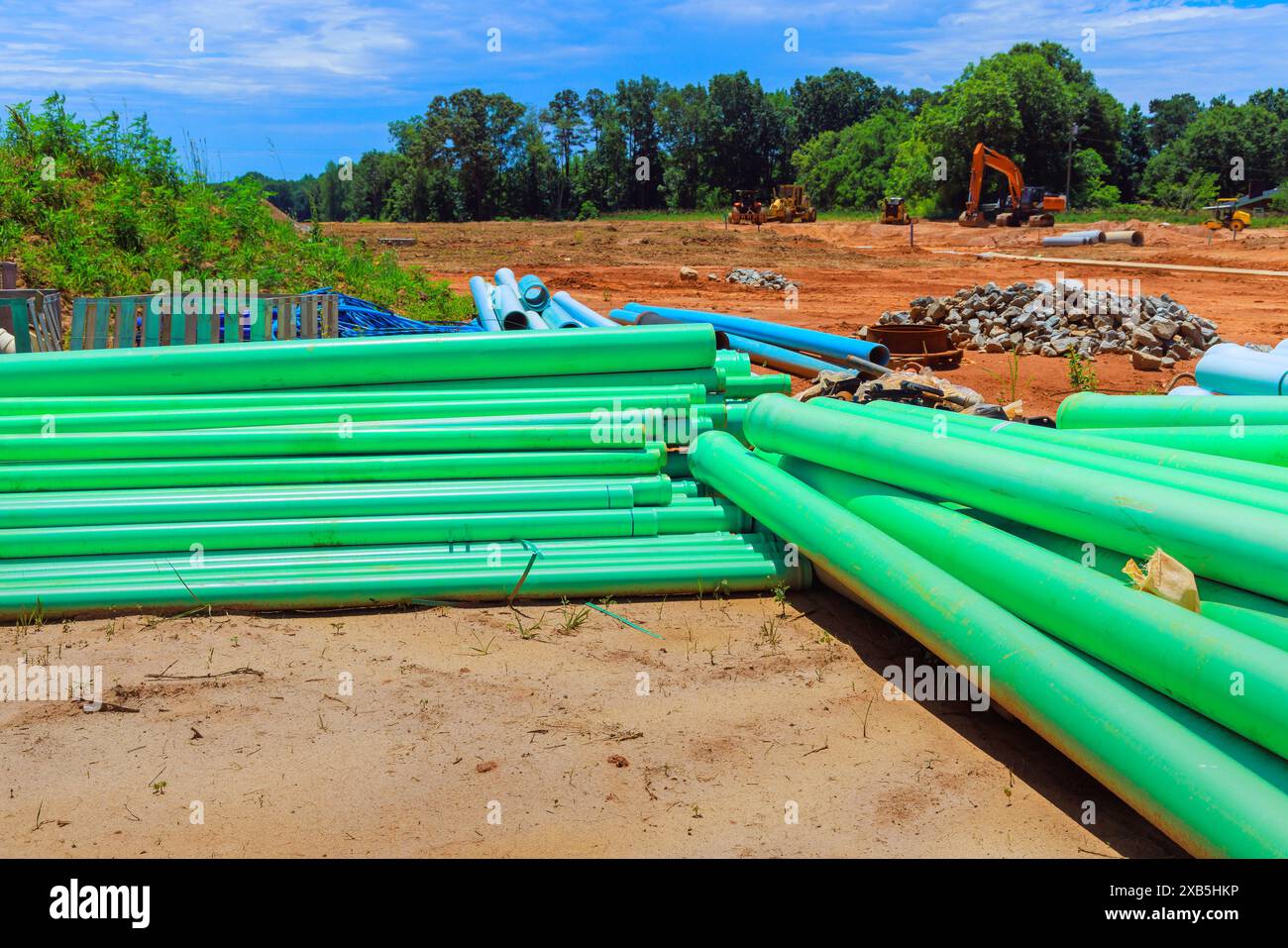 On construction site there are green PVC pipes used to lay pipe water ...