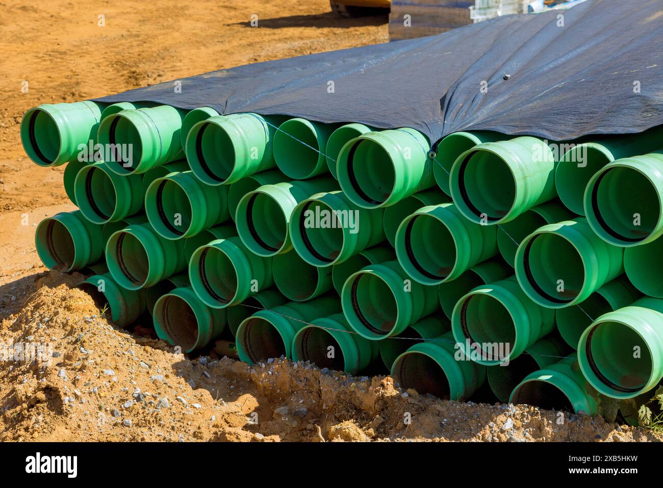 There are green PVC pipes installed on construction sites for ...