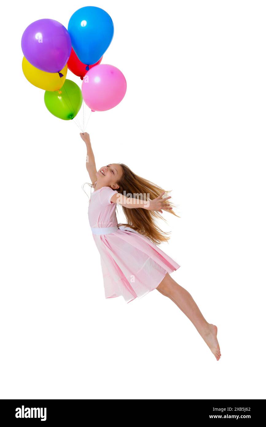 girl flying with balloons on white background Stock Photo - Alamy