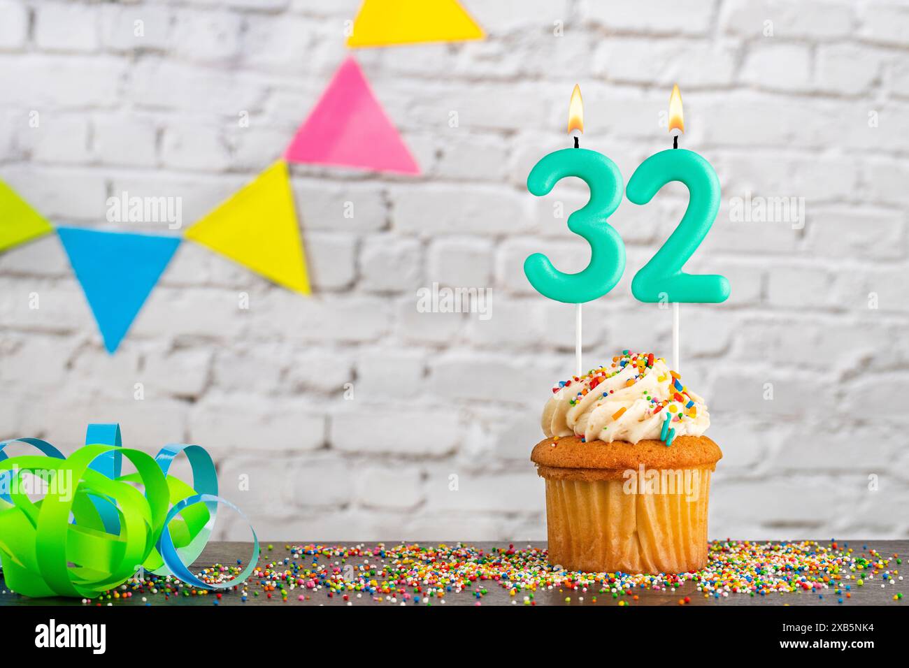 Green birthday candle - Candle number 32 Stock Photo - Alamy