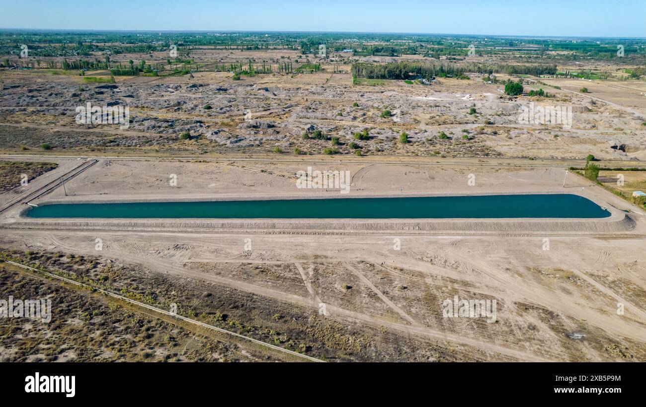 Aerial view of artificial water reservoir for agricultural irrigation ...