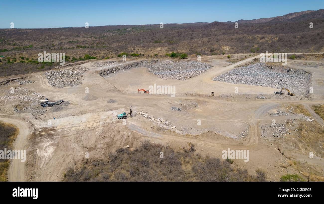 Machines working in cement quarry Stock Photo - Alamy