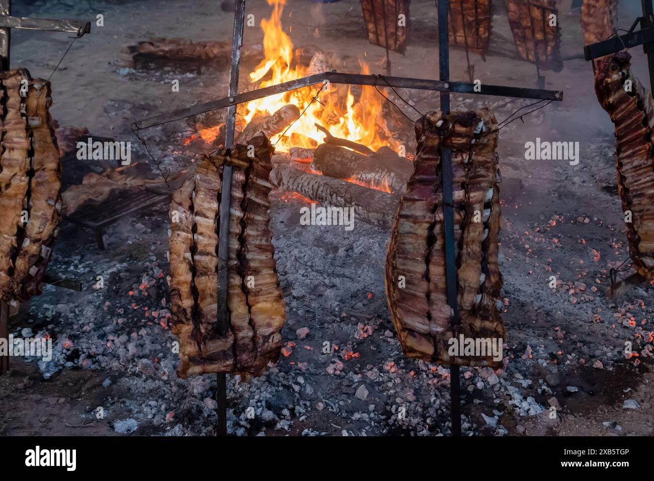 Asado, traditional barbecue dish in Argentina, roasted meat cooked on a ...