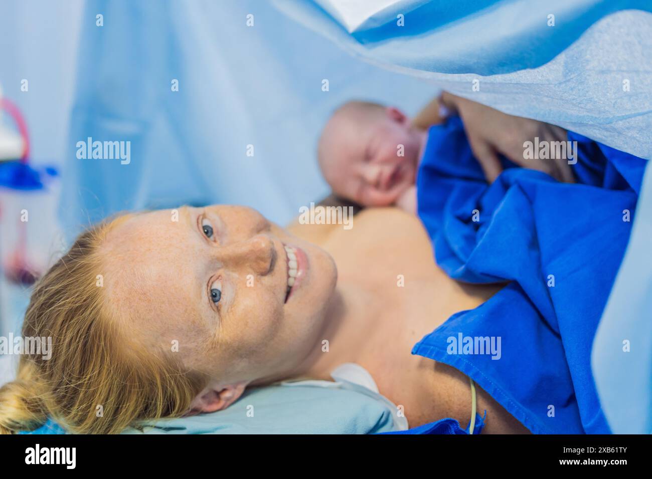 Baby on mother's chest immediately after birth in a hospital. The ...