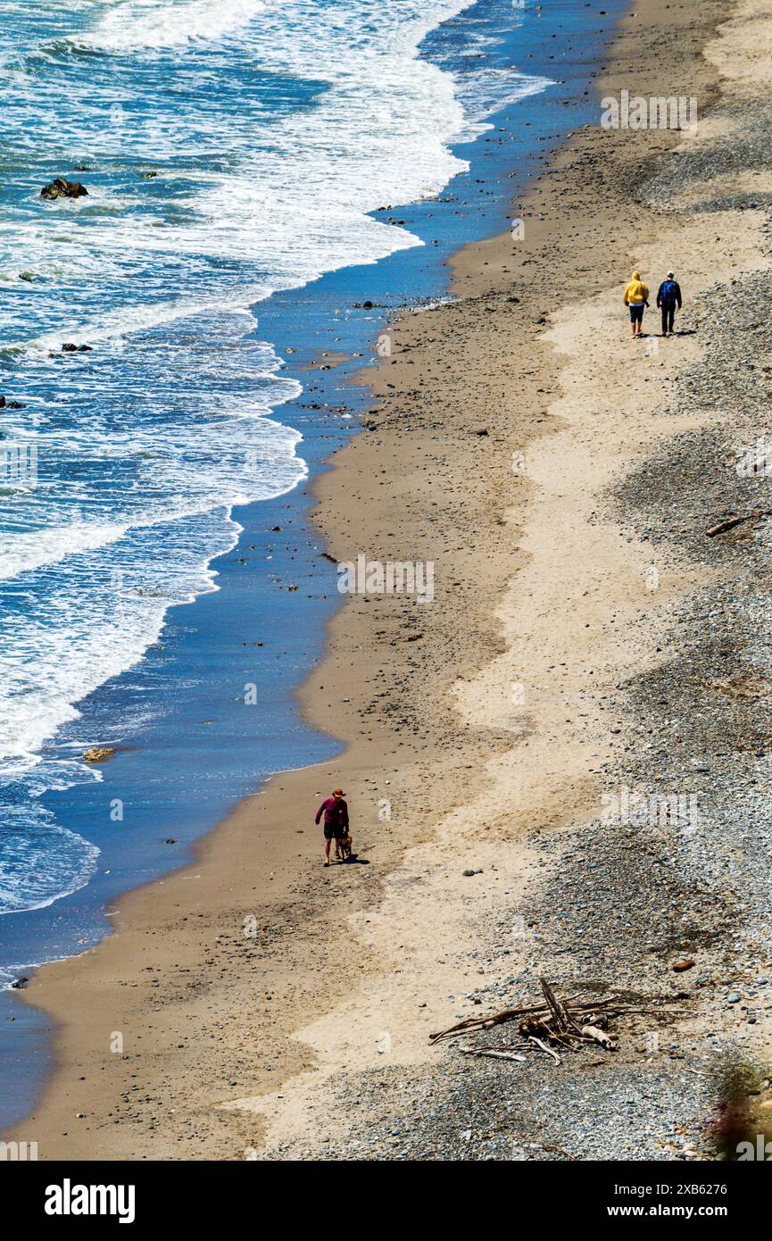 Visitors walk the Pacific Ocean beach at Douglas Family Preserve; Santa ...