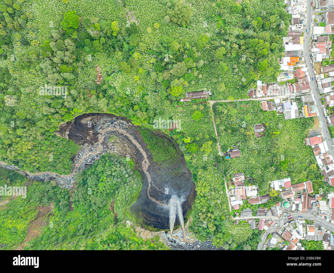 Aerial top view Coban Sriti Waterfall twin Waterfall stream that flows ...